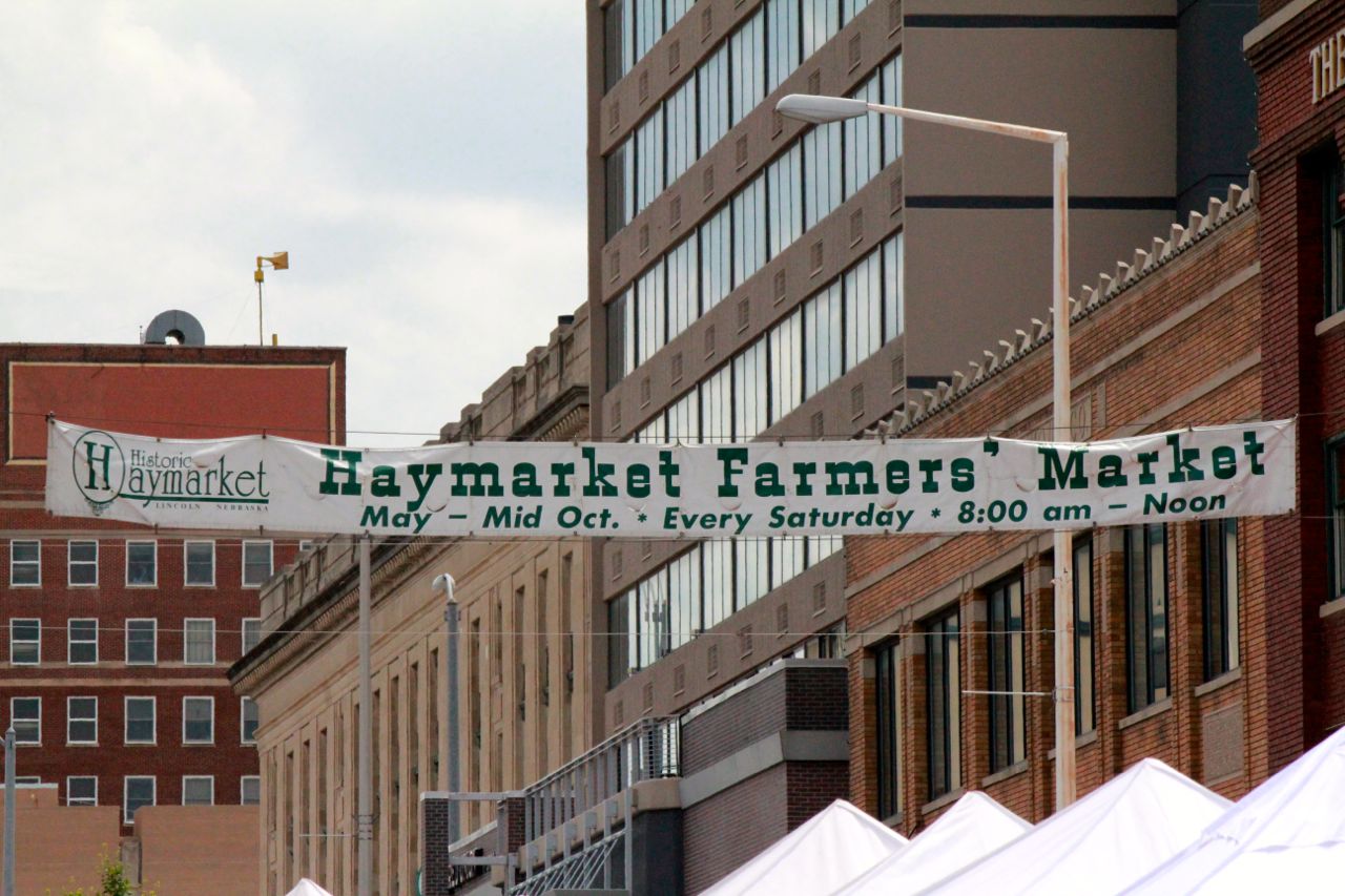 Playing with flowers at the Harvest Home Farm booth - vomitingchicken.com